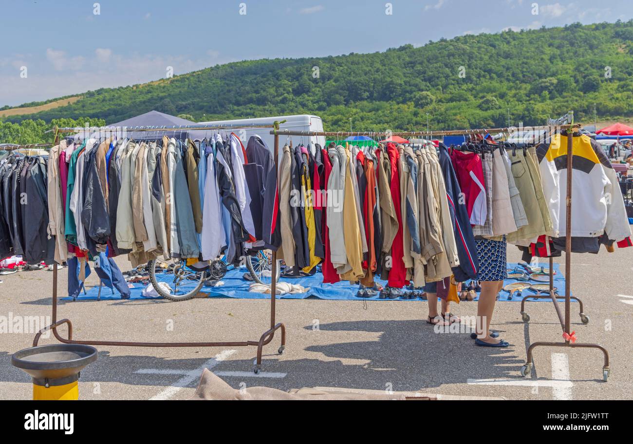 Second Hand Jackets Tops at Railing Flea Market Stock Photo - Alamy