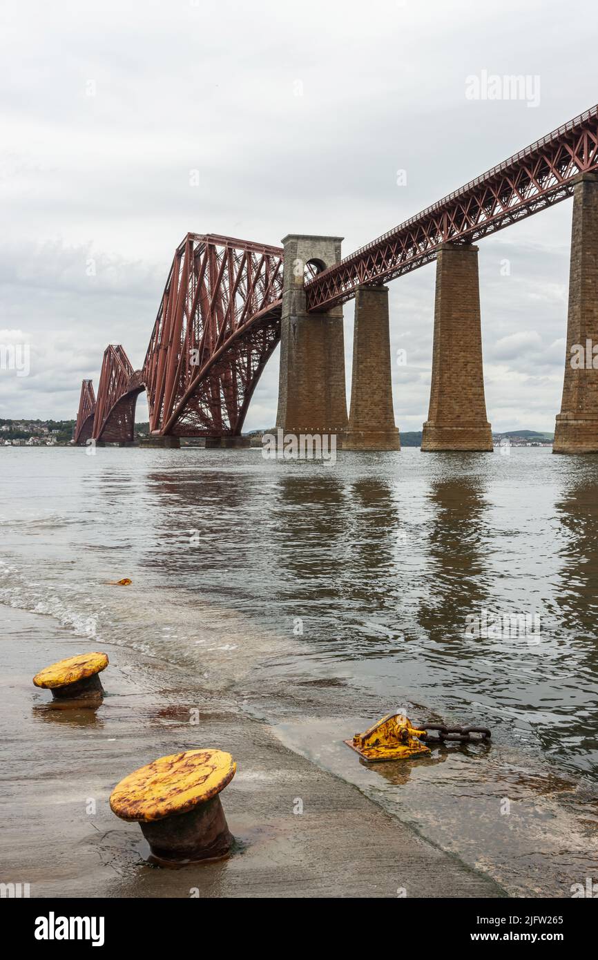 Forth Bridge from below, with Firth of Forth visible and clear sky ...