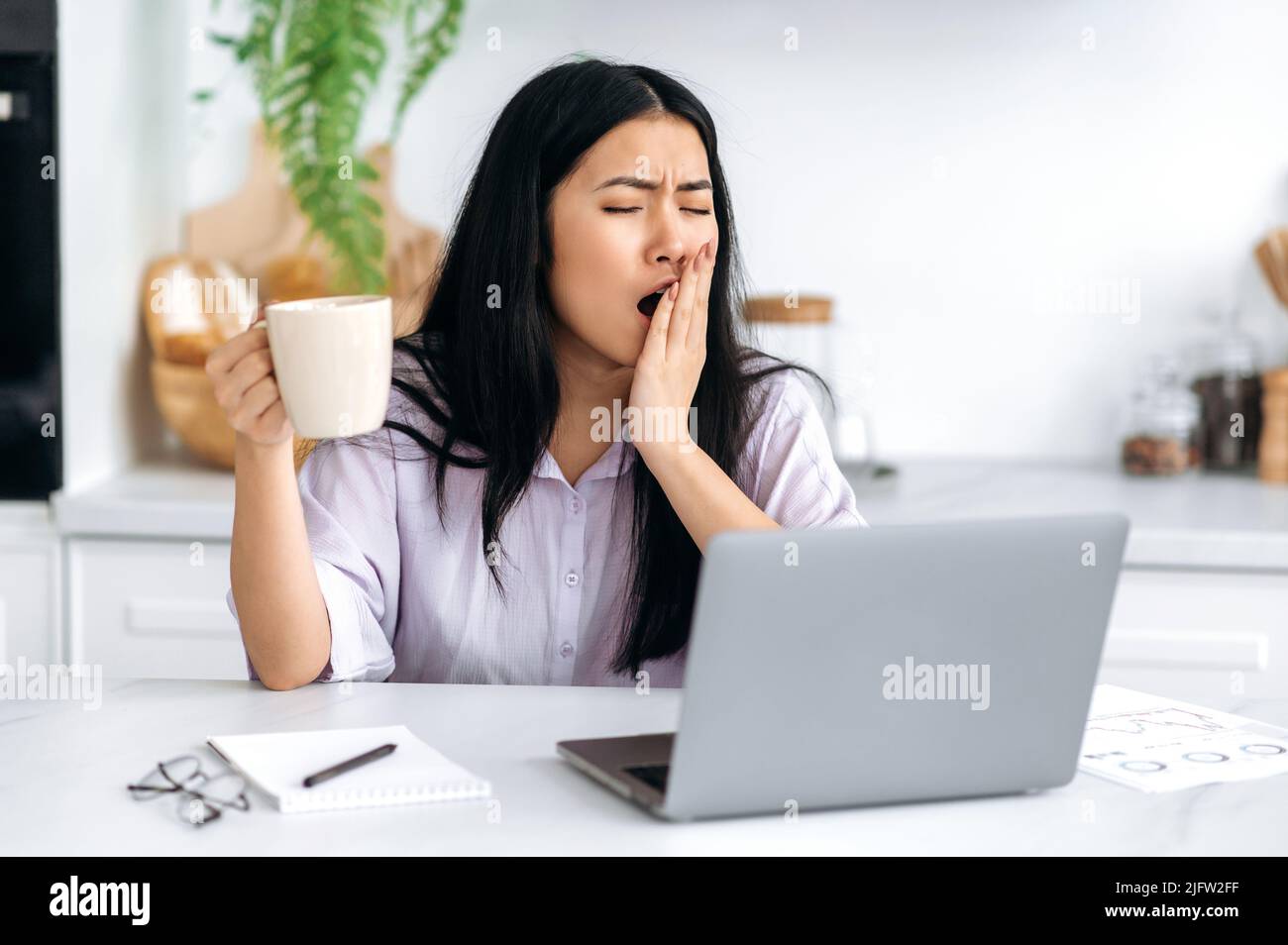 Japanese employee yawning hi-res stock photography and images - Alamy