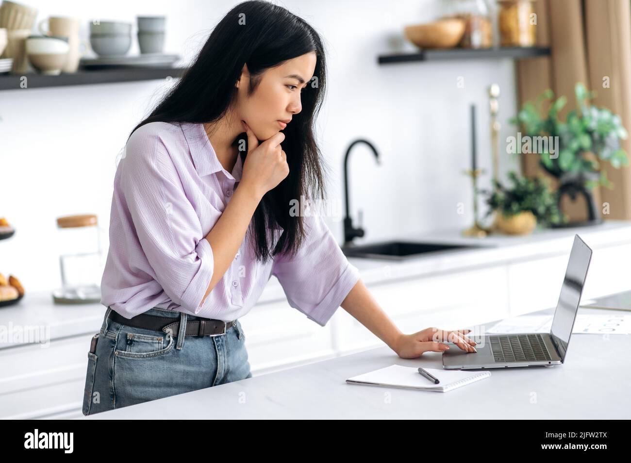 Stylish modern pretty Chinese girl, manager, freelancer, working from ...