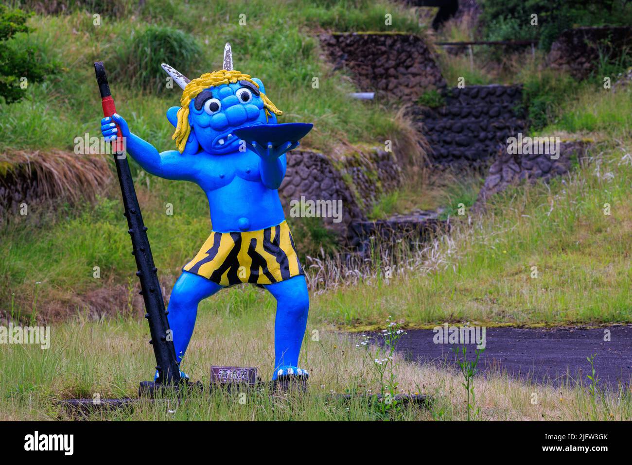 Blue Japanese oni demon in front of dry stone riverbed Stock Photo - Alamy