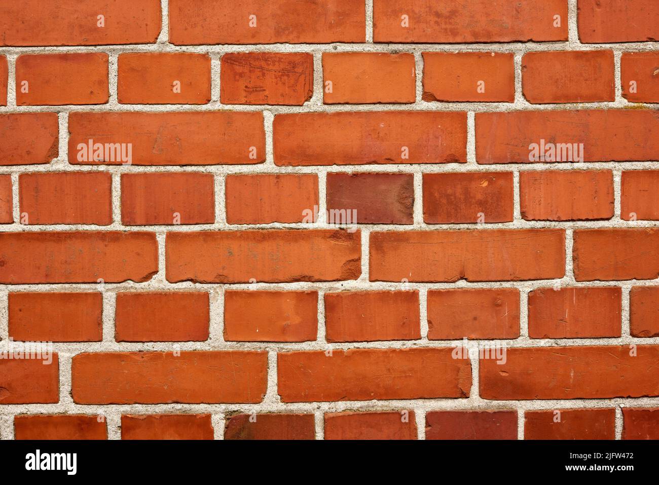 Closeup of a strong red brick wall and copy space on exterior of a home ...