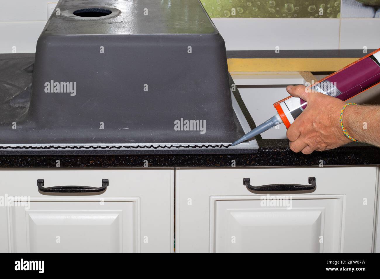 Silicone gun applying sealant hi-res stock photography and images - Alamy