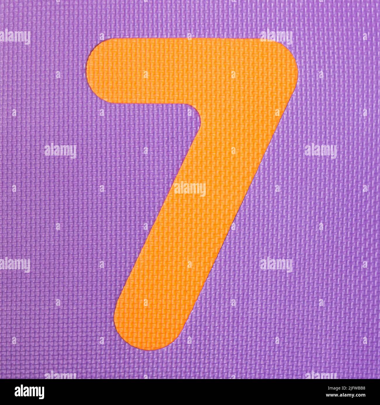 Colourful number foam puzzle mat for children. Number seven Stock Photo ...