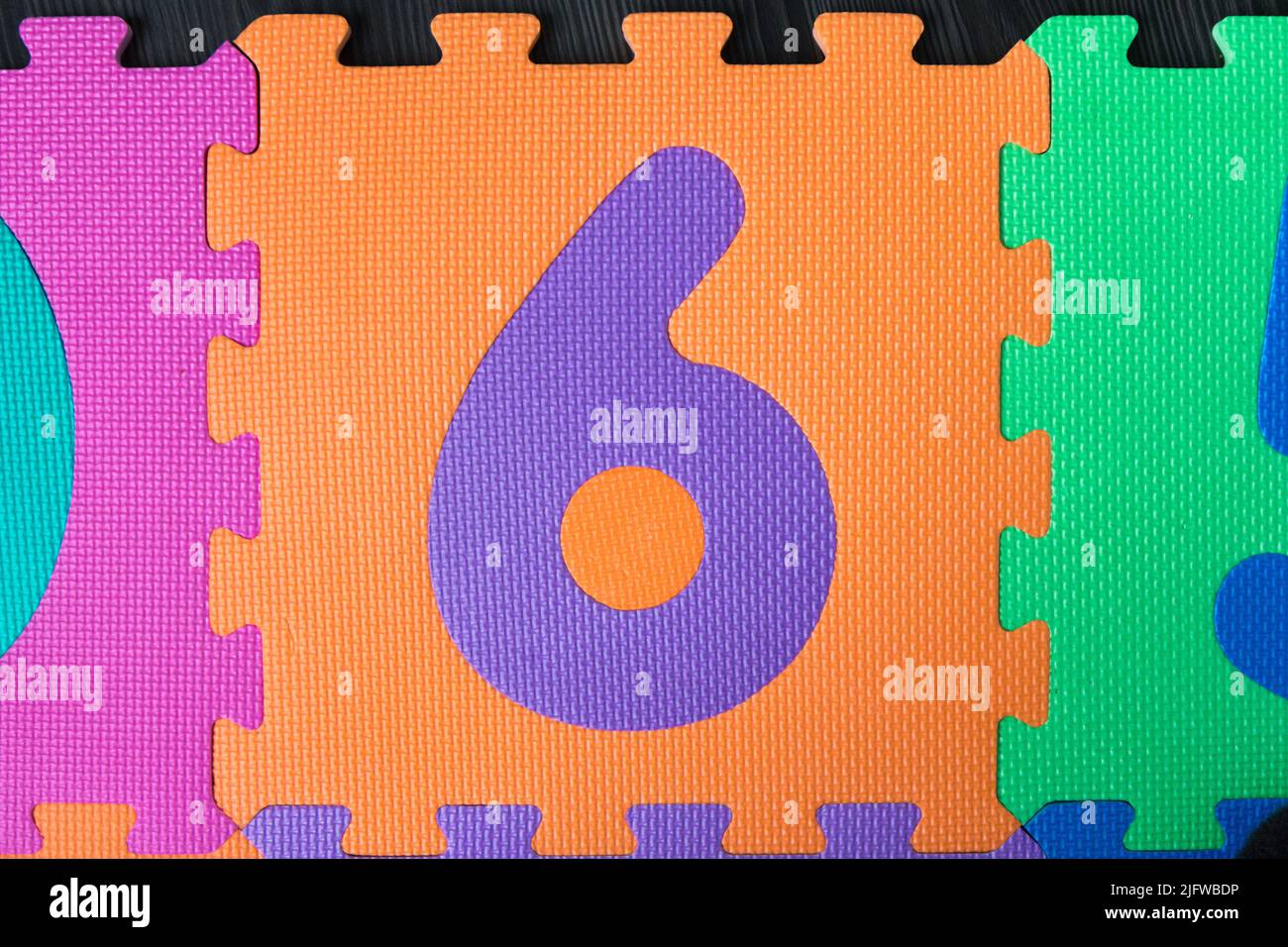 Colourful number foam puzzle mat for children. Number six Stock Photo ...