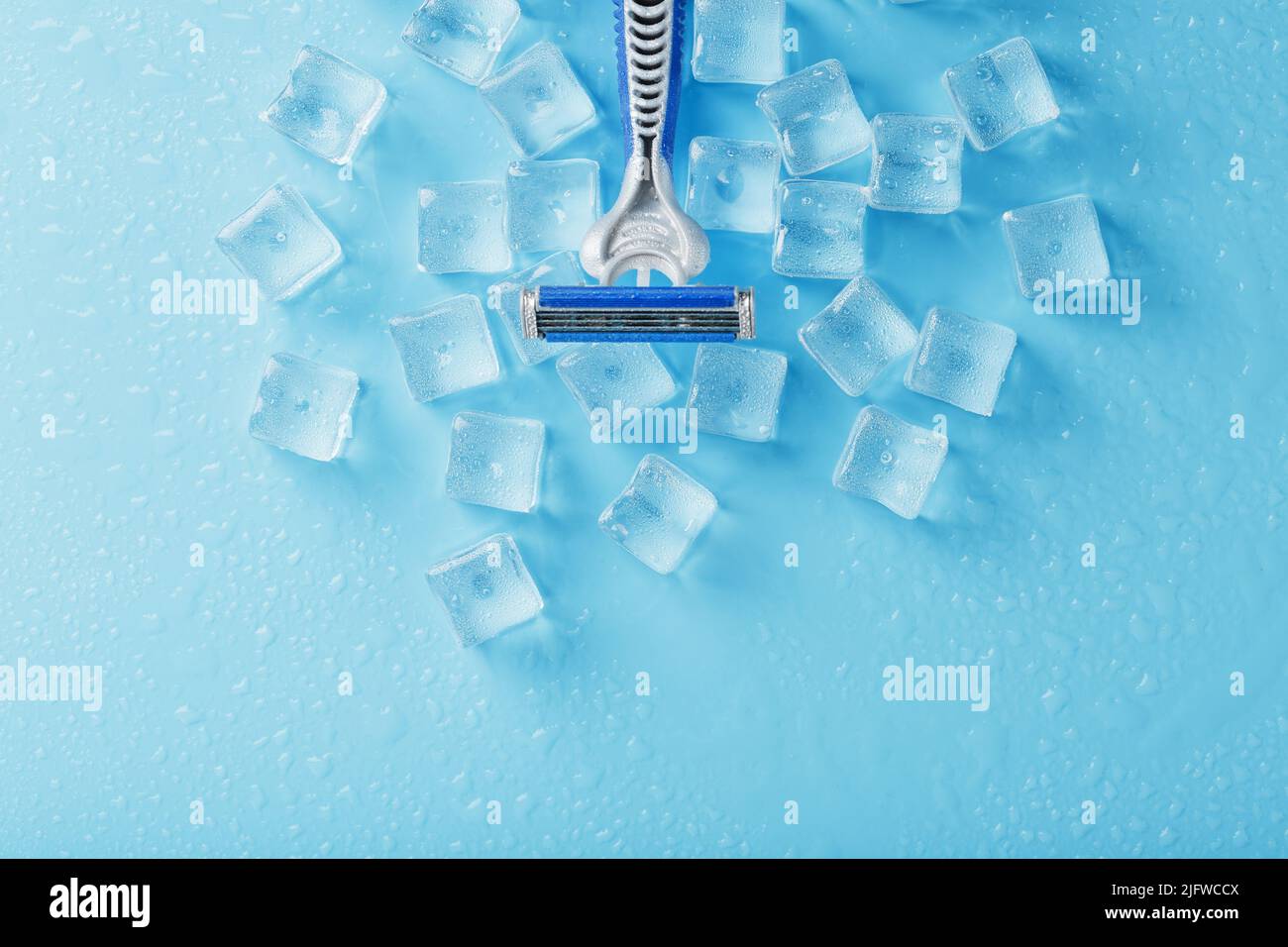 Blue shaving machines in a row on a blue background with ice cubes. The ...