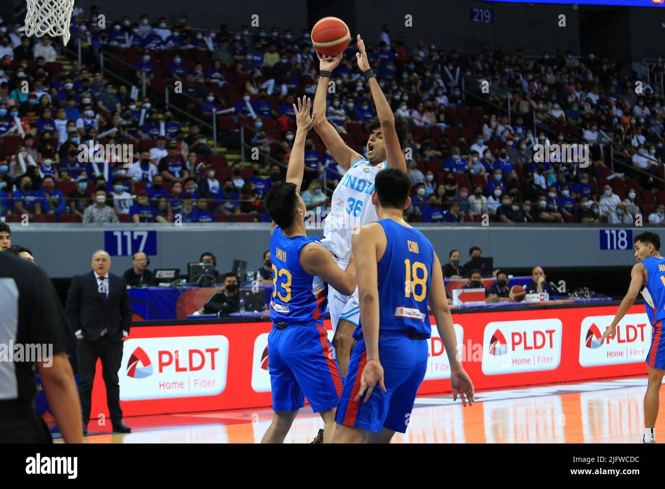 (7/3/2022) Aryan (36, White) of India shoots over two defenders of the ...