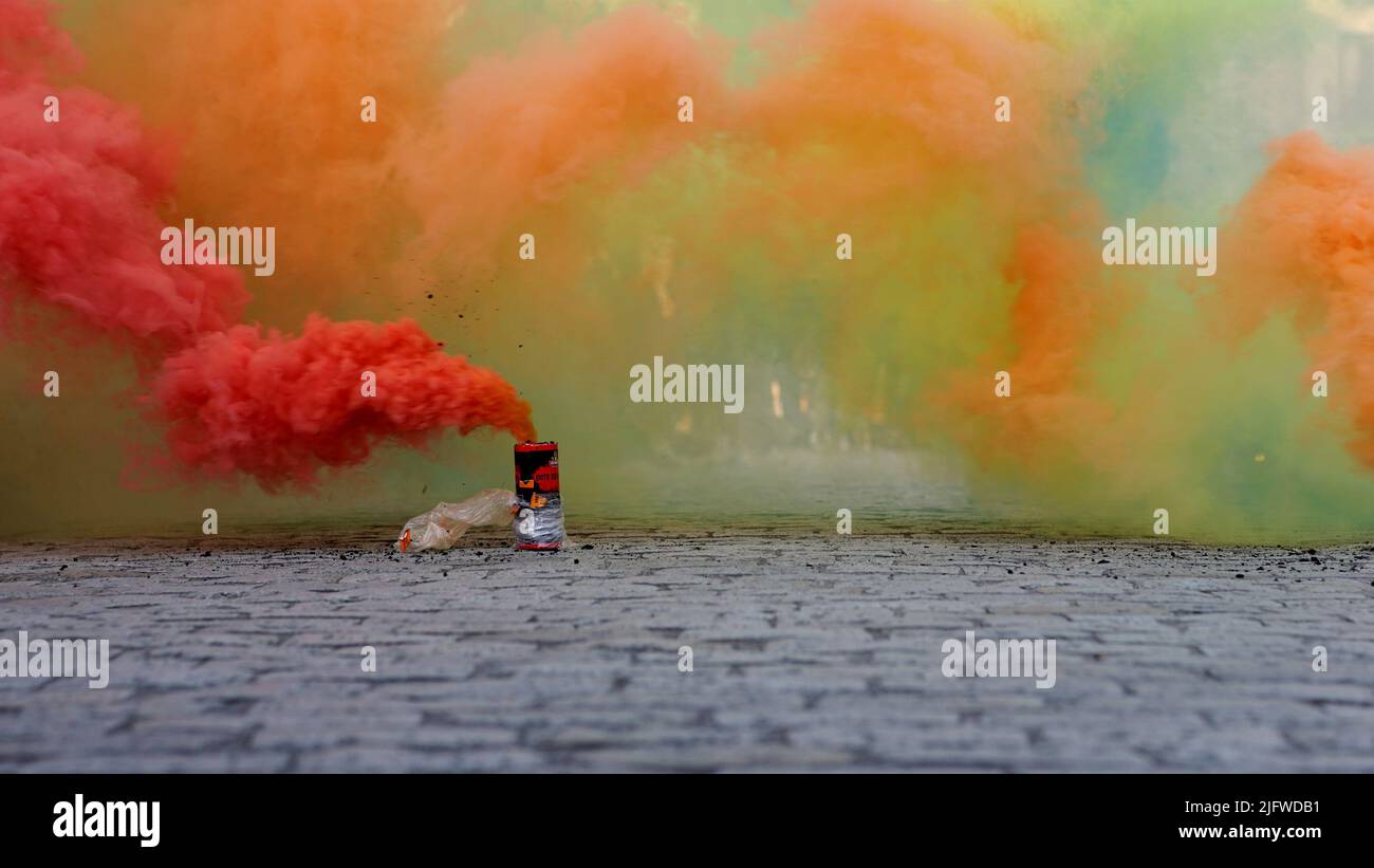 Red color smoke bomb on pride day. Focus selective Stock Photo - Alamy