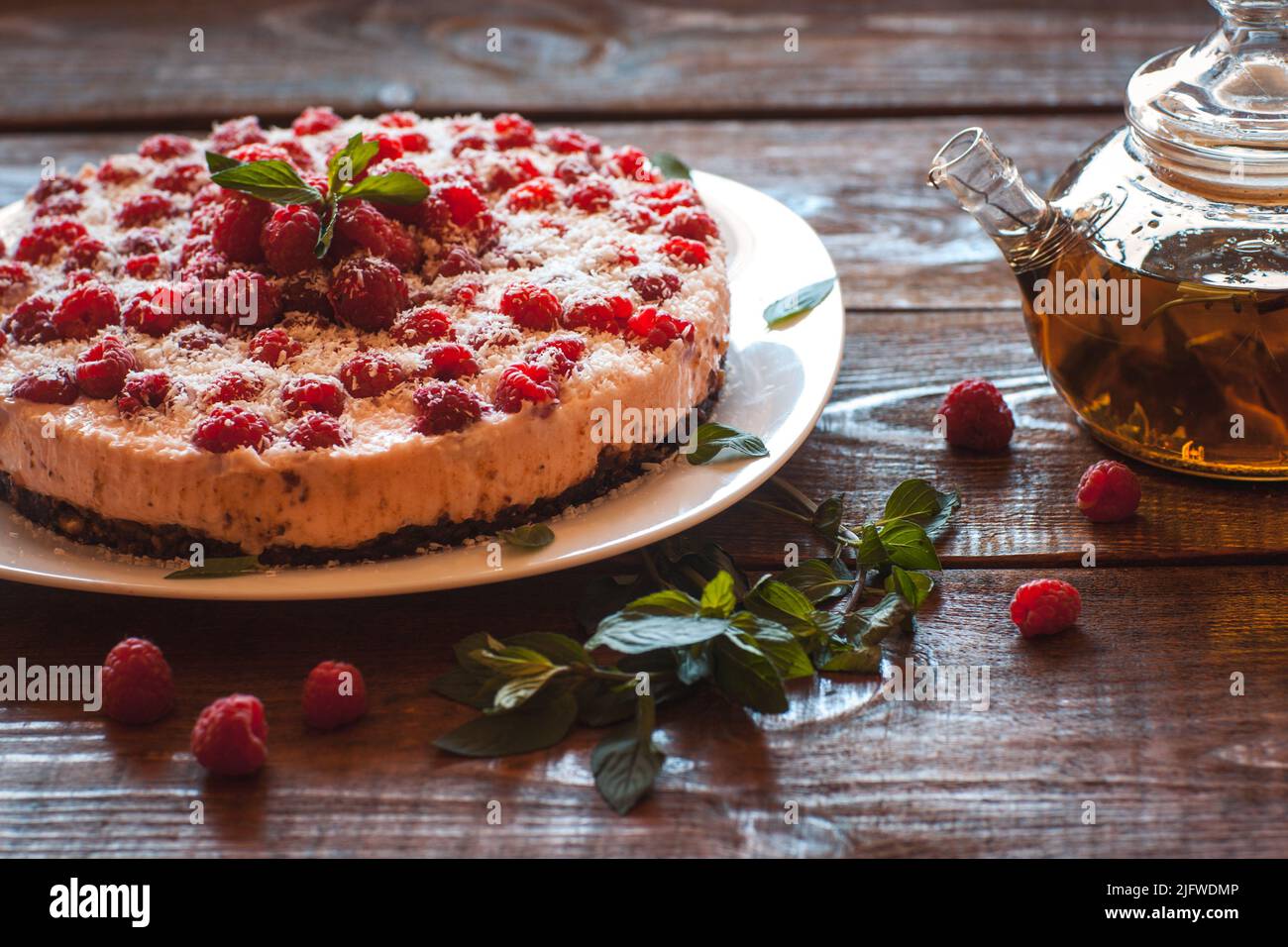 Vegan raspberry cake and green tee Stock Photo - Alamy