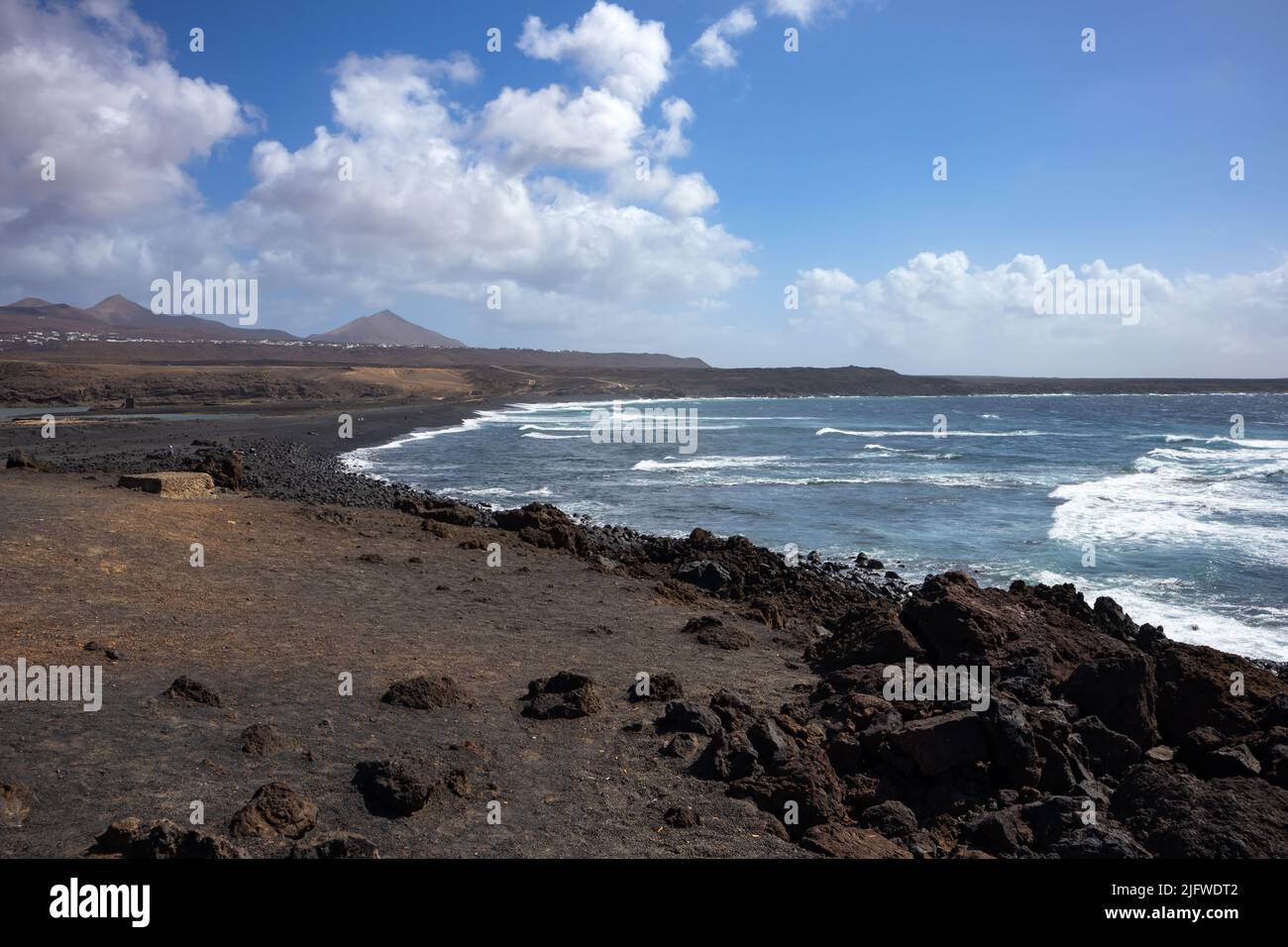 Rocks made of dark brown to black lava, creating the Atlantic ocean ...