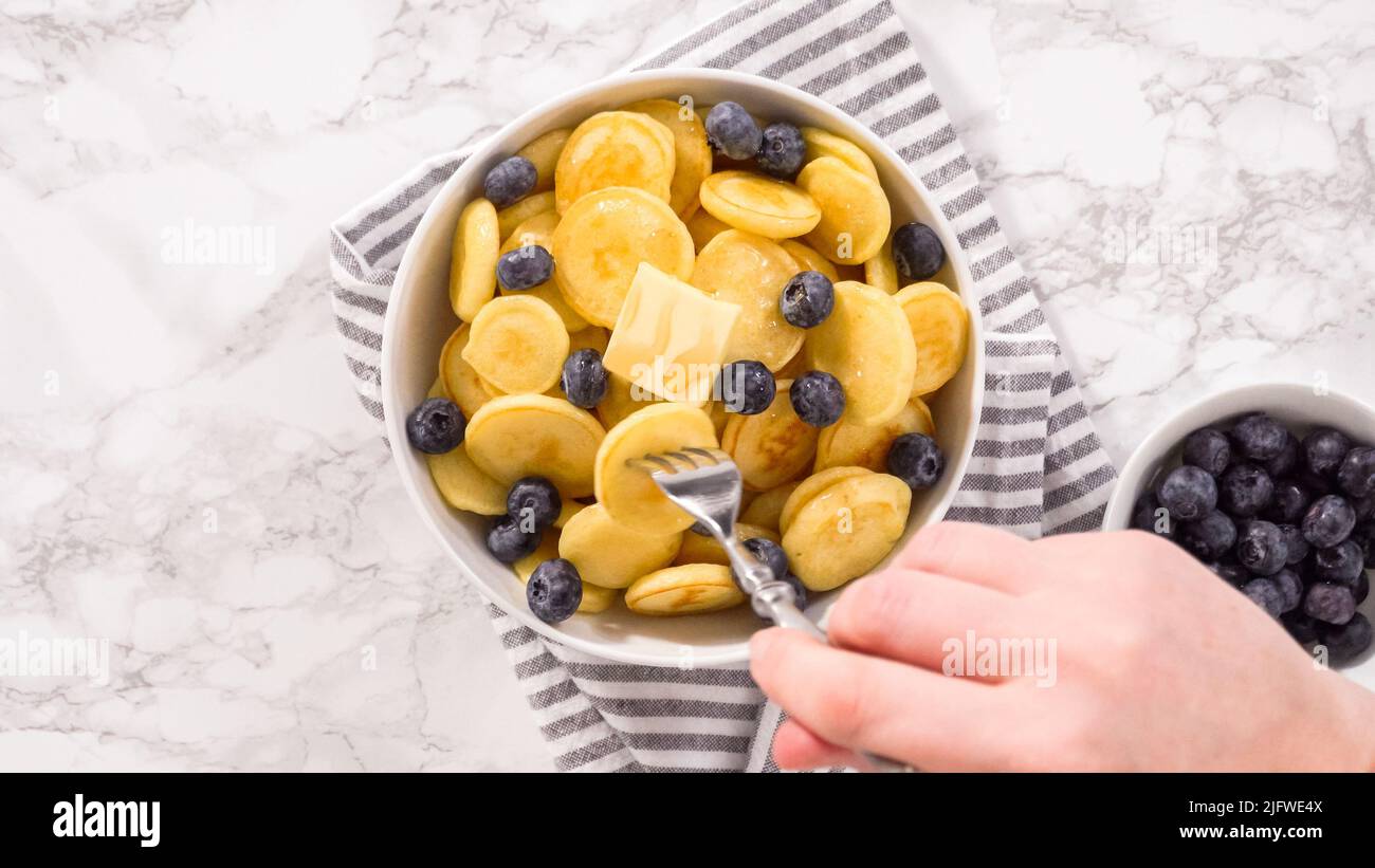 Flat lay. Step by step. Freshly made mini pancake cereal with fresh ...