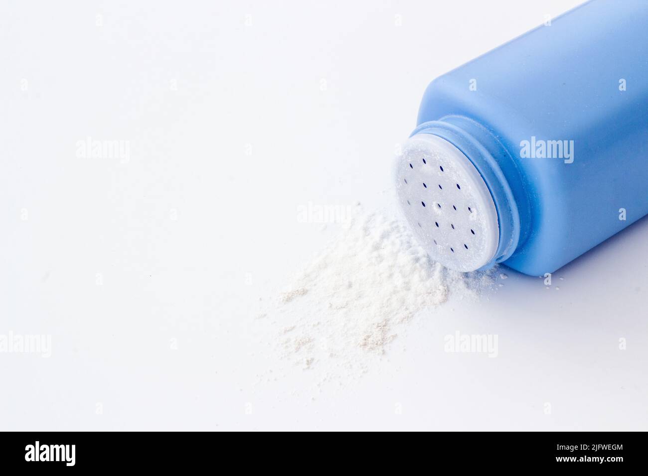 Talcum powder in container. Spilled white powder Stock Photo - Alamy
