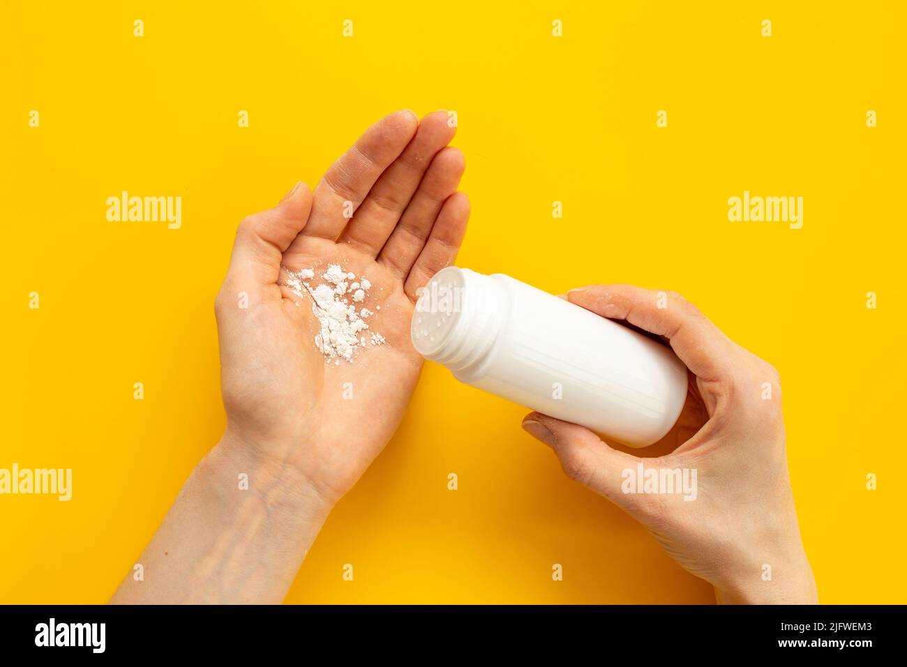 Applying white talcum powder on hand. Skin care cosmetic Stock Photo ...