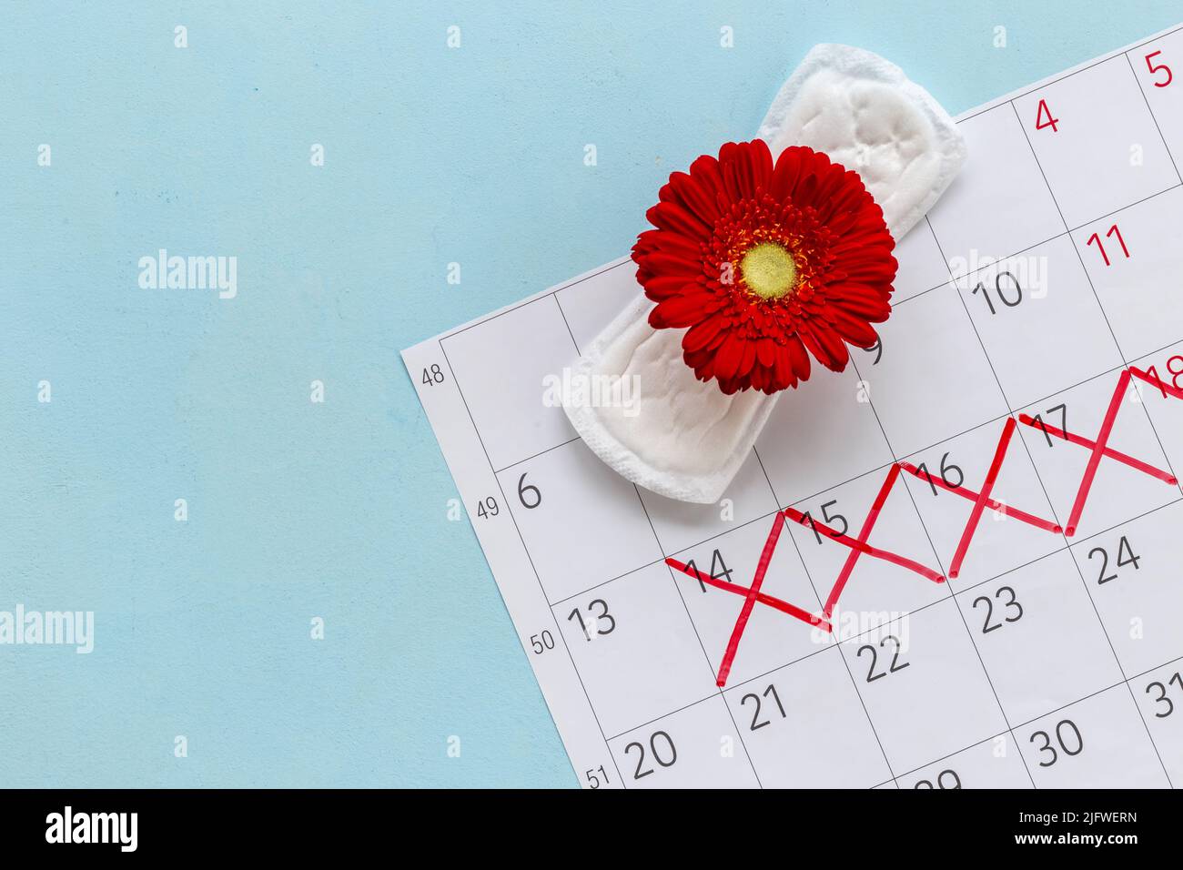 Calendar with red marks and white pad. Menstruation period concept ...
