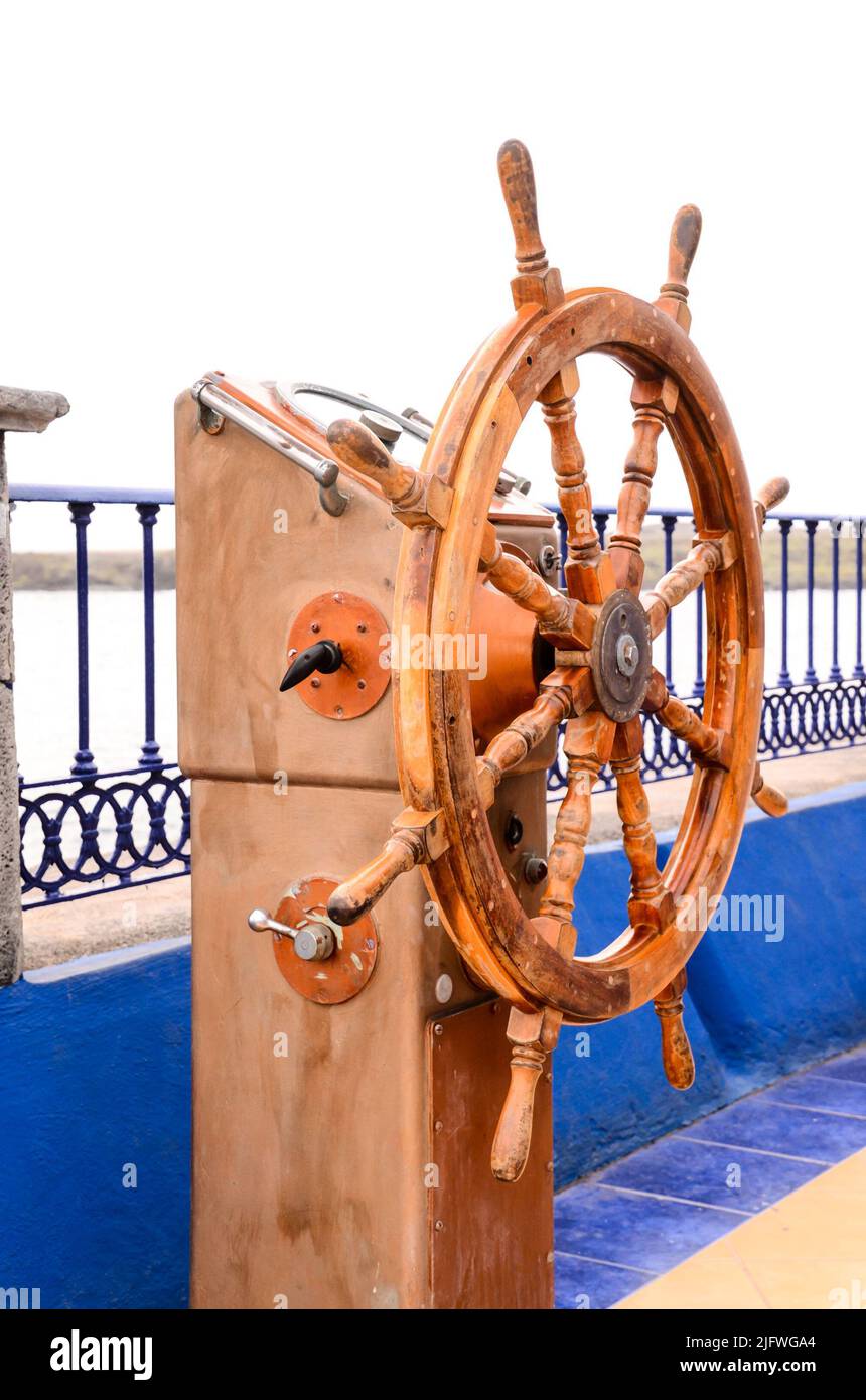 Old Vintage Wooden Helm Wheel near Blue Ovcean Stock Photo - Alamy