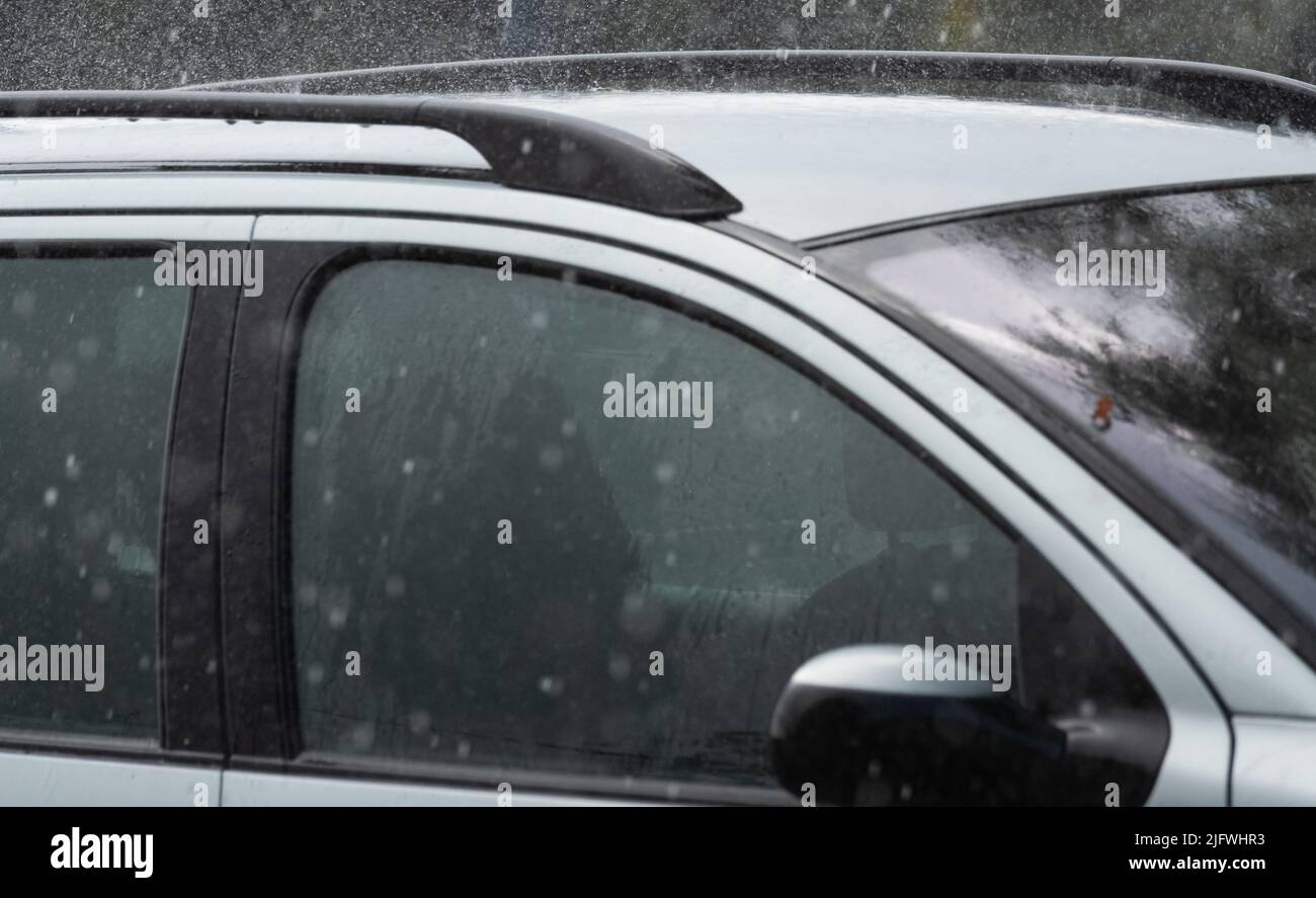 Rain falling on car window hi-res stock photography and images - Alamy