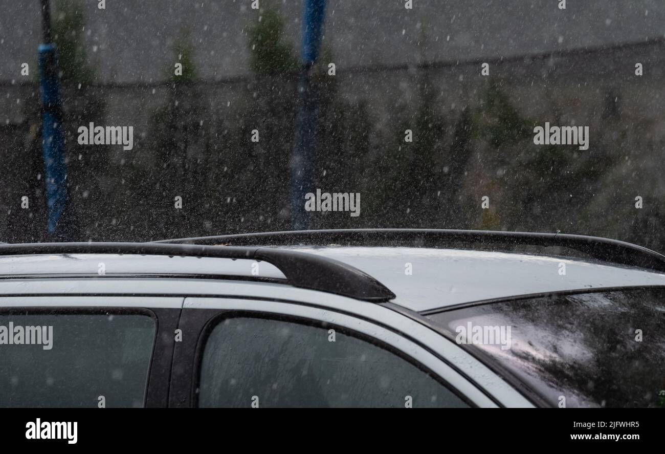 Car in the rain. Close-up of raindrops falling on a passenger car Stock ...