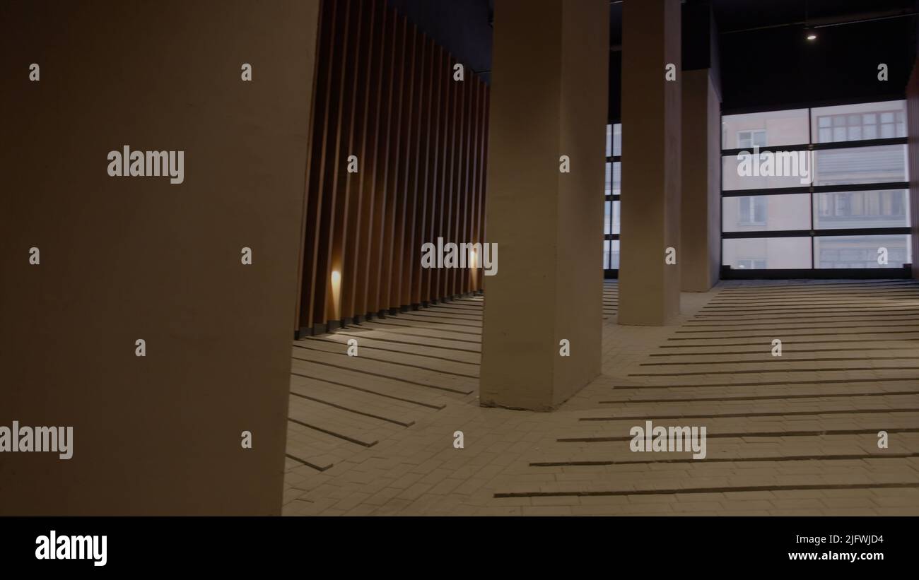A bright corridor.Stock footage.Large columns and windows in the office ...