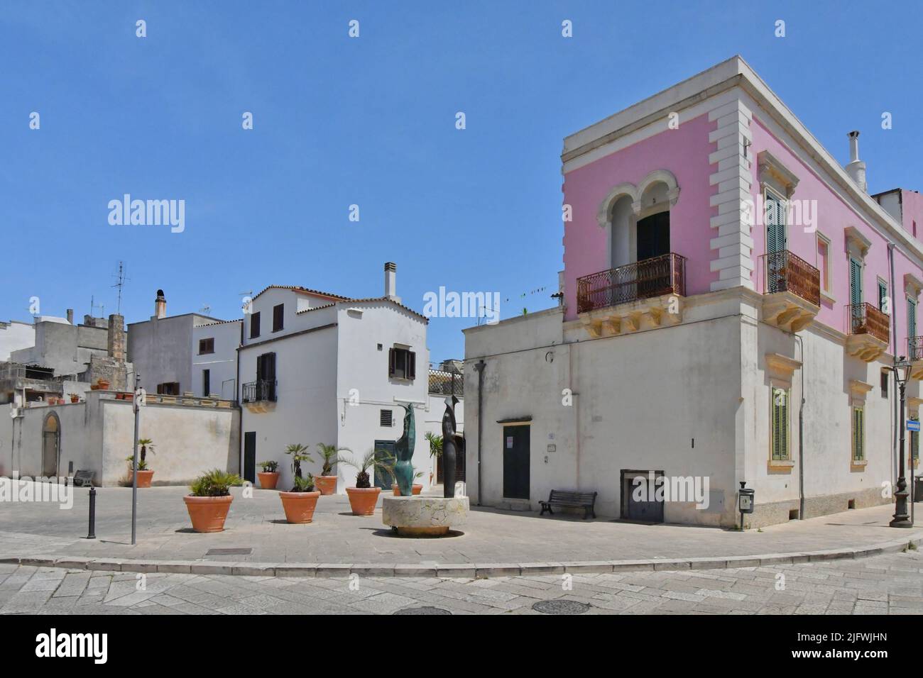 The town square of Specchia, a medieval village in the Puglia region of ...