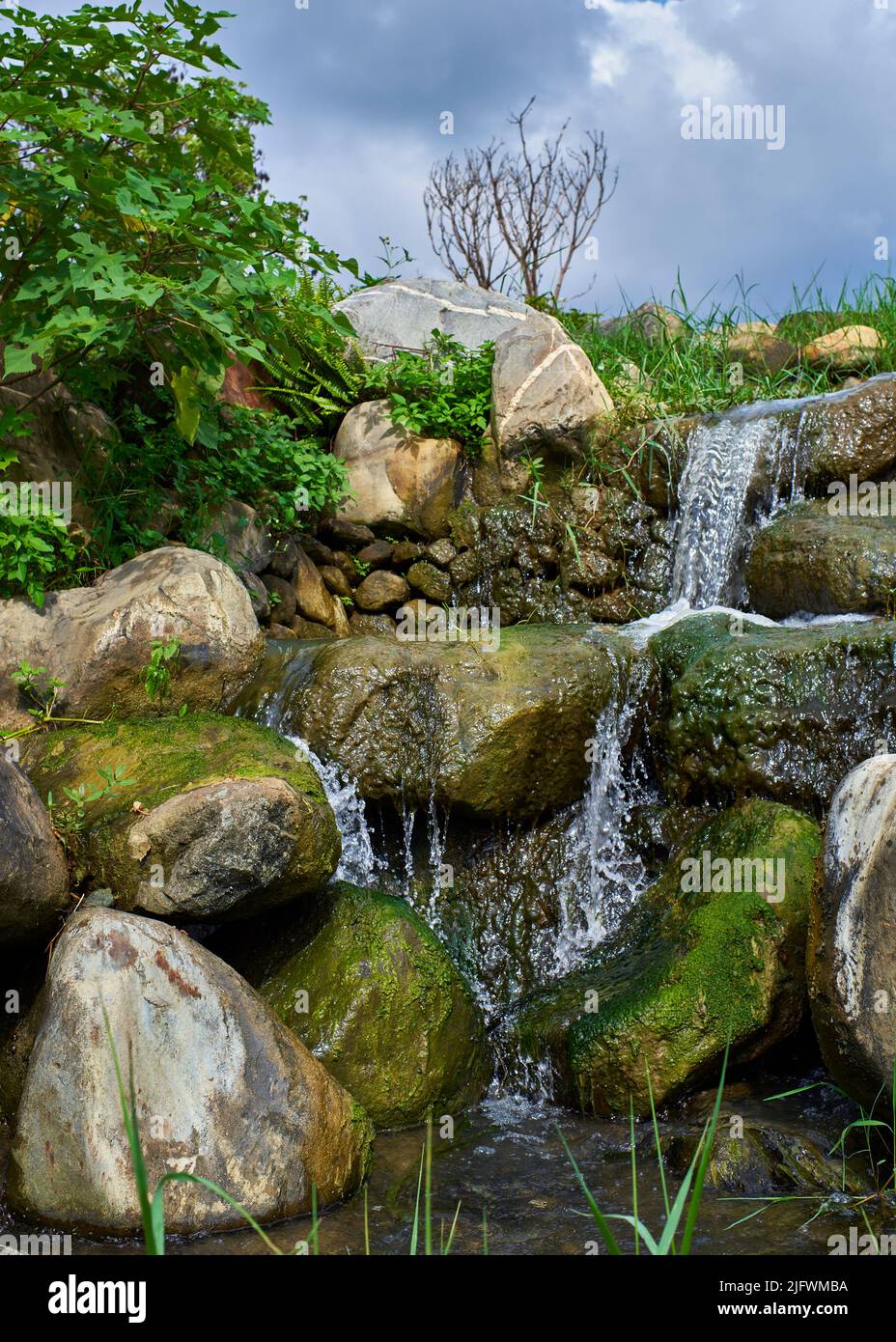 Water flows through the river and waterfall Stock Photo - Alamy