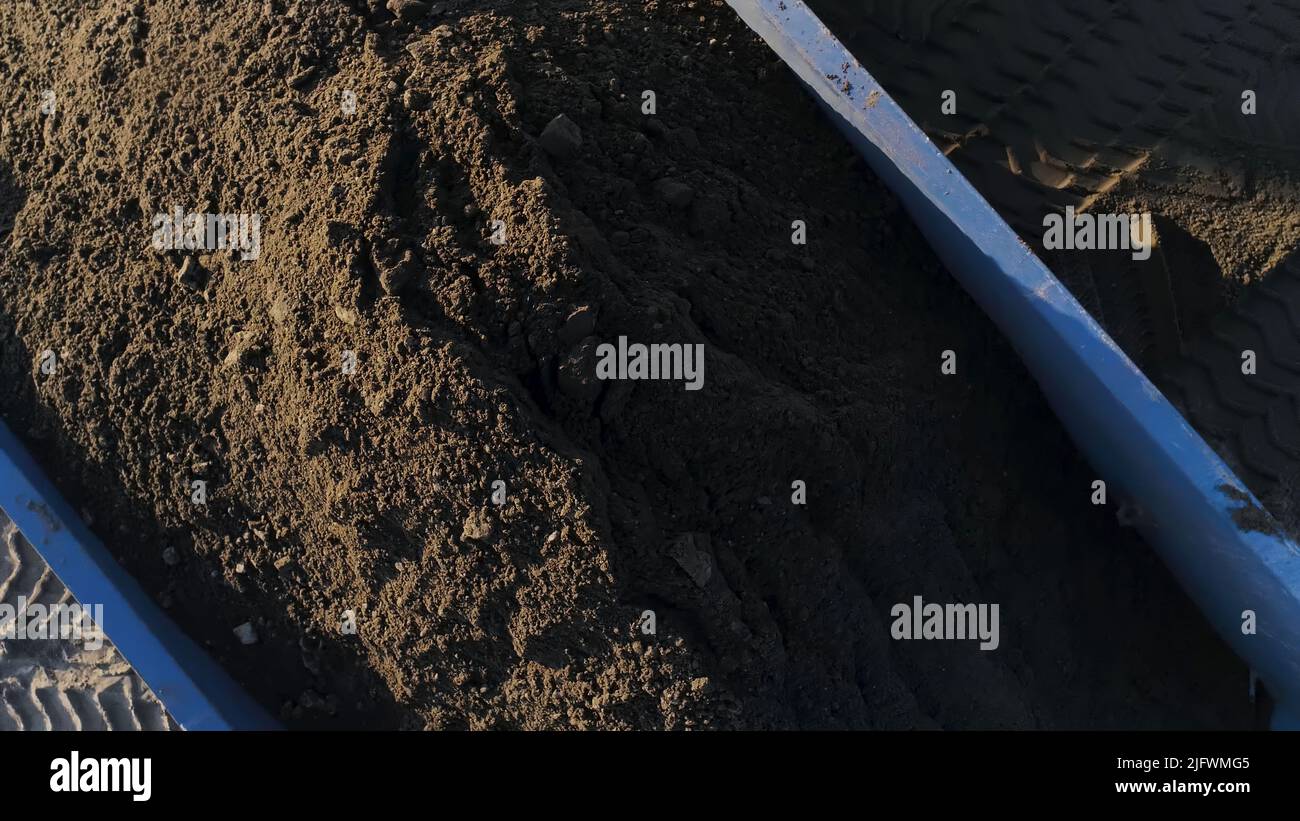 Full dump truck of earth. Scene. Top view of dump truck with earth on ...