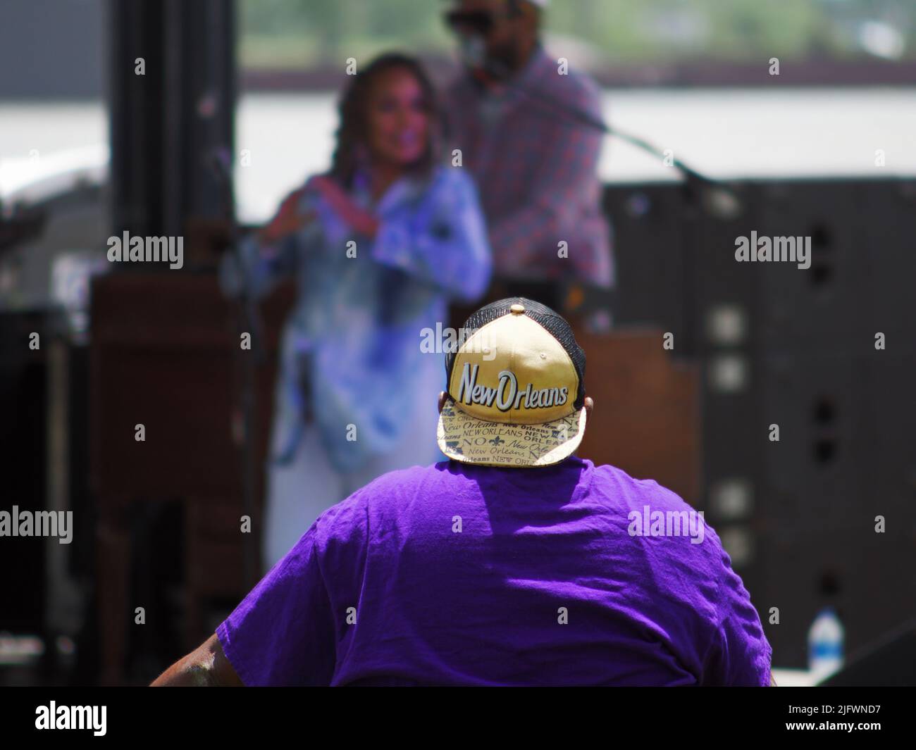 A man watching musicians performing on the stage Stock Photo - Alamy
