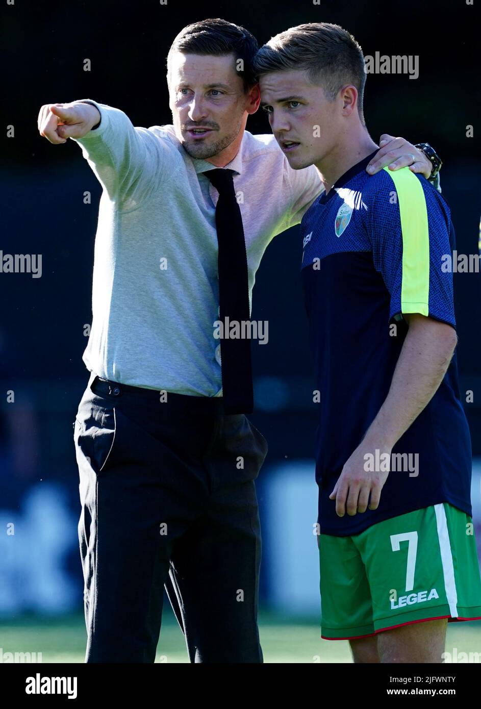 The New Saints manager Anthony Limbrick (left) speaks with Joshua ...