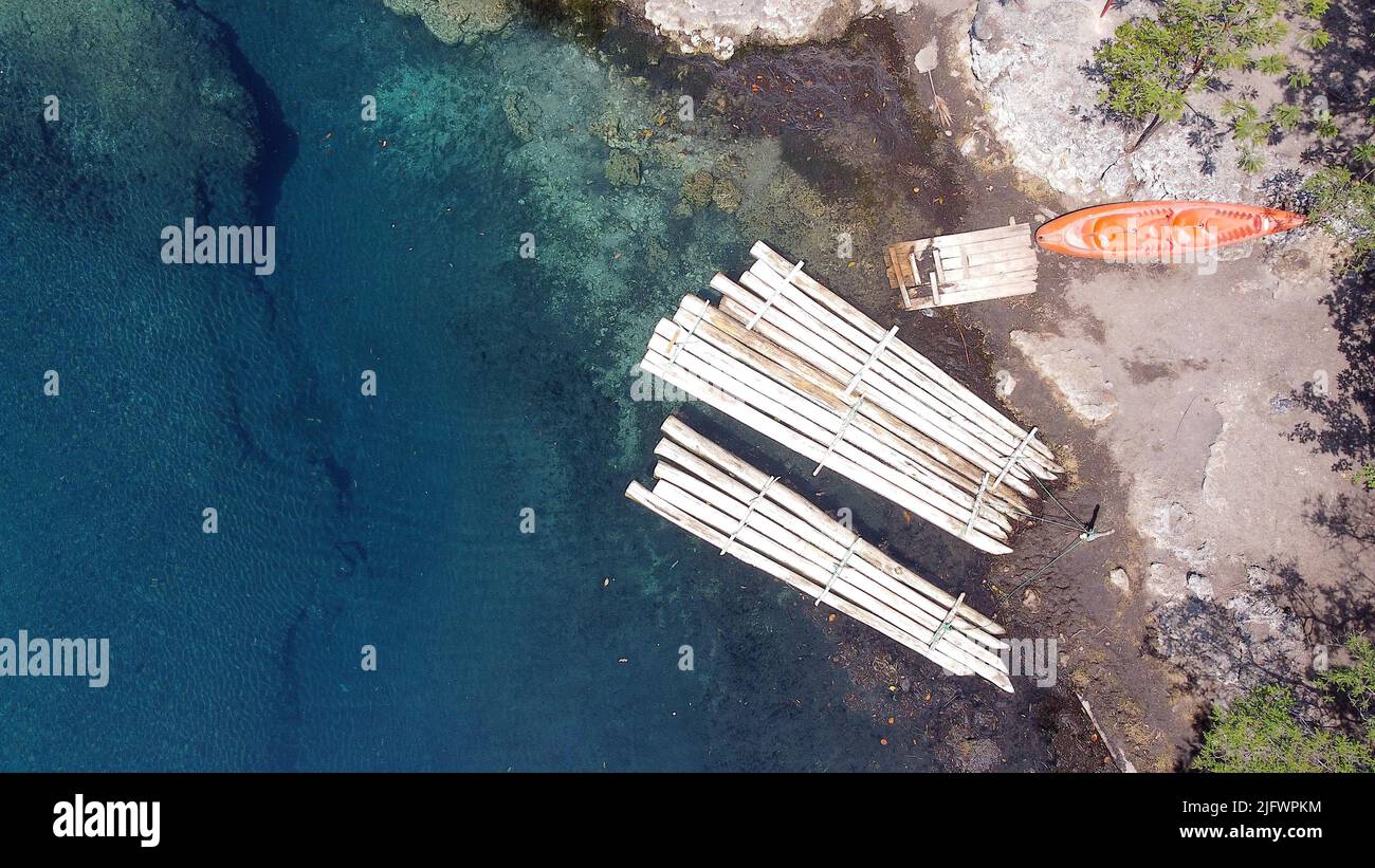 A bird's eye view of floating platform on the azure water near the ...
