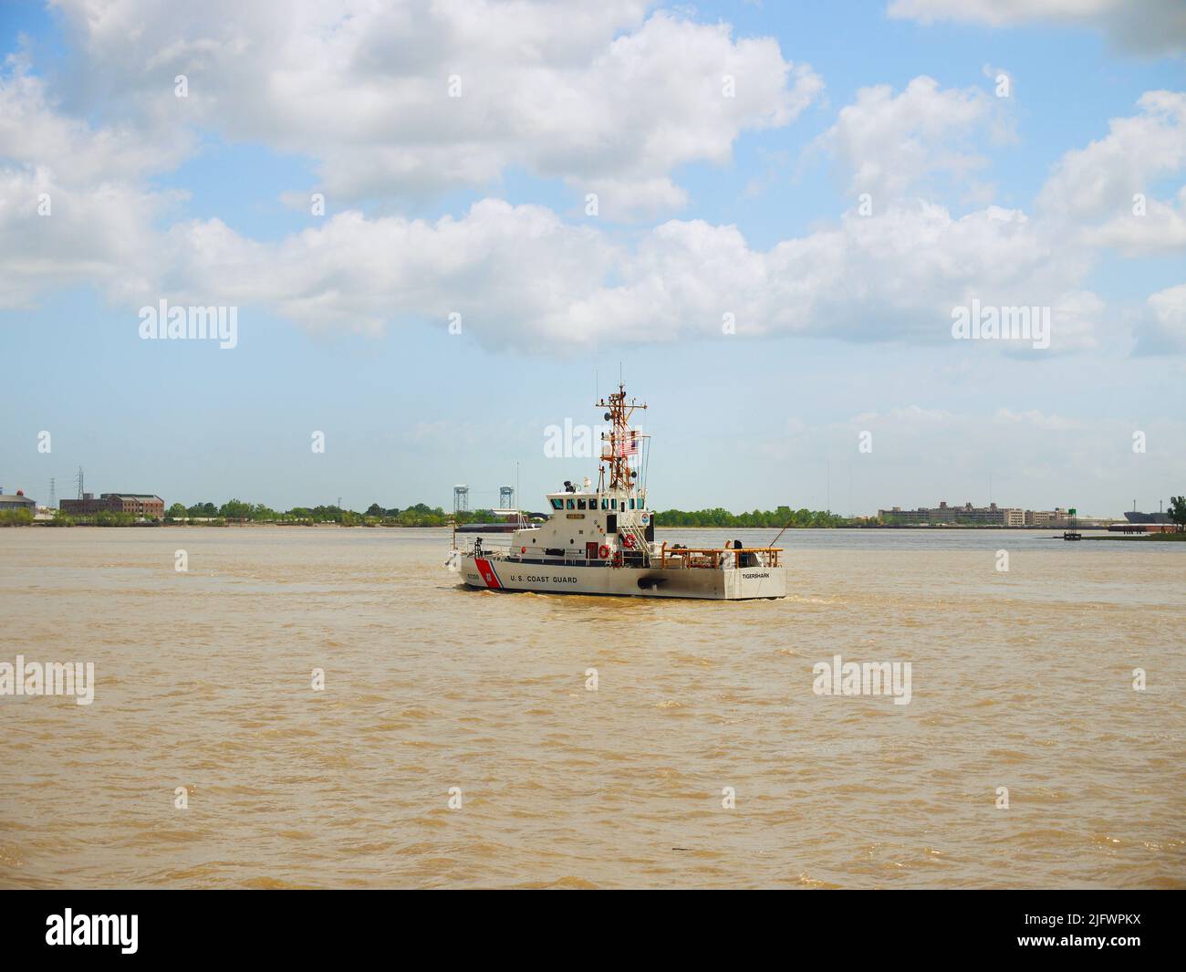 A United States Coast Guard boat patrols the Mississippi River Stock ... A United States Coast Guard boat patrols the Mississippi River Stock ...
