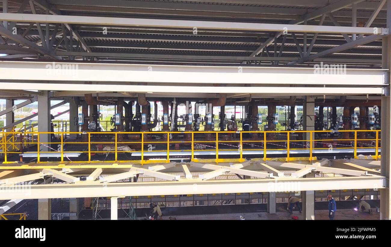 Top view of open industrial building with workers. Clip. Factory with ...