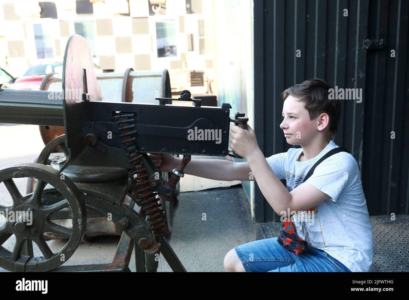 Portrait of child with Maxim machine gun Stock Photo - Alamy