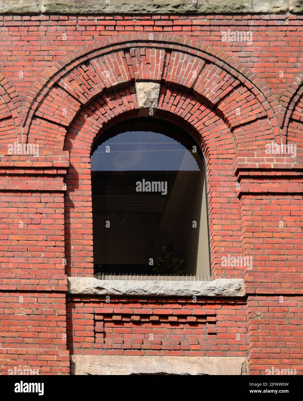 Palladium Window in Old Brick Building Stock Photo - Alamy