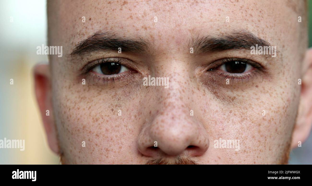 Handsome white man opening eyes feeling serene and relaxed. Close-up ...