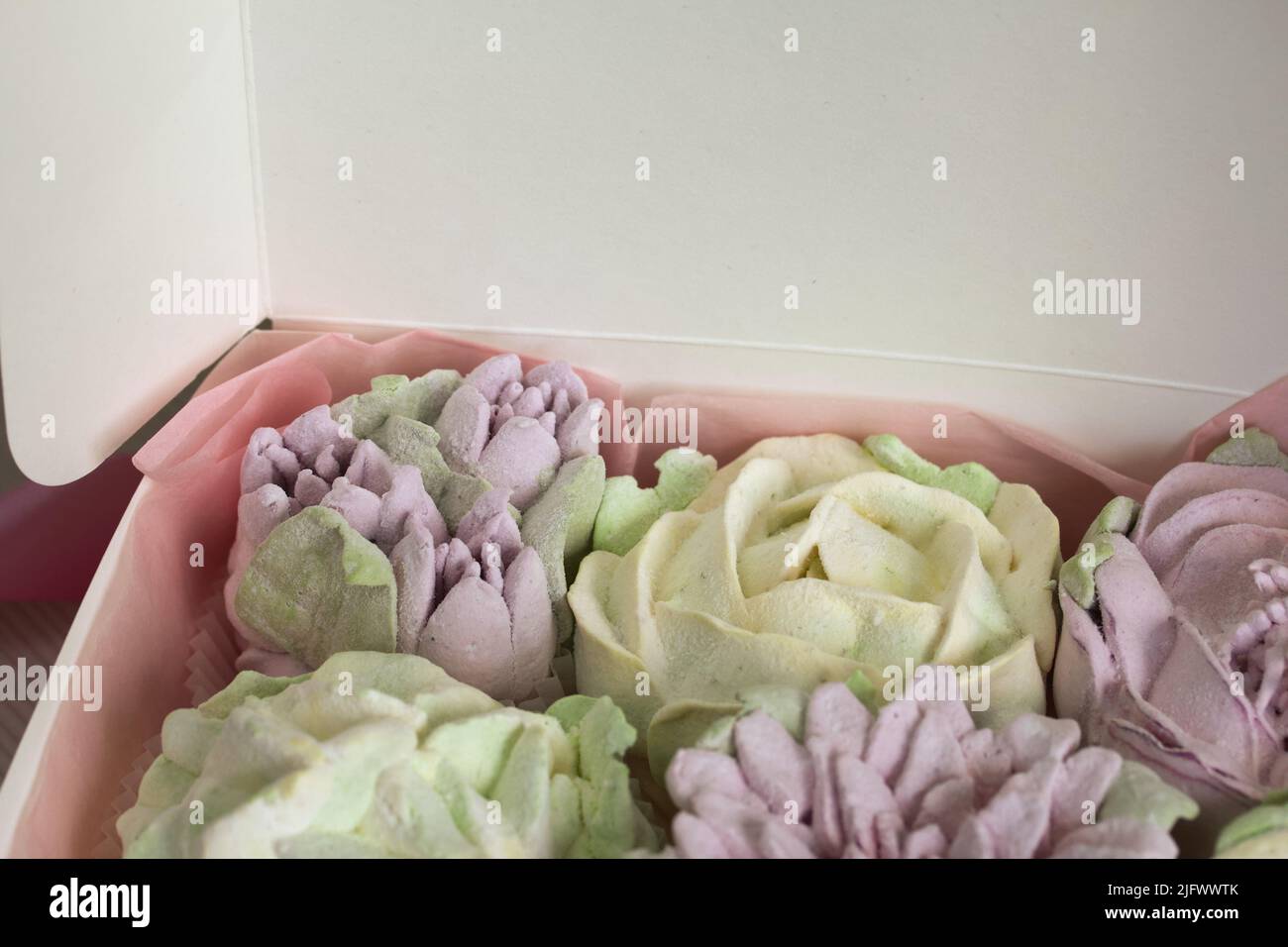 Homemade marshmallows packed in a gift box. Zephyr made in the form of ...