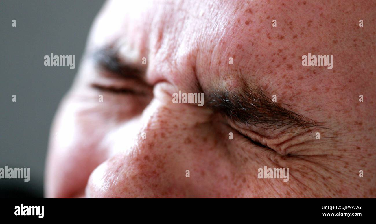 Man squinting eyes close-up face, redhair closeup eye squint Stock ...