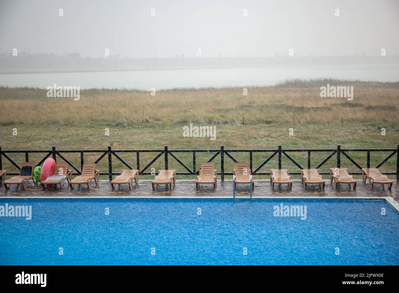 Rain and wind spoil the summer weather at the vacation center Stock ...