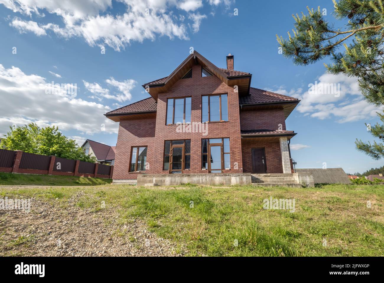 two-story concrete or brick country house Stock Photo - Alamy