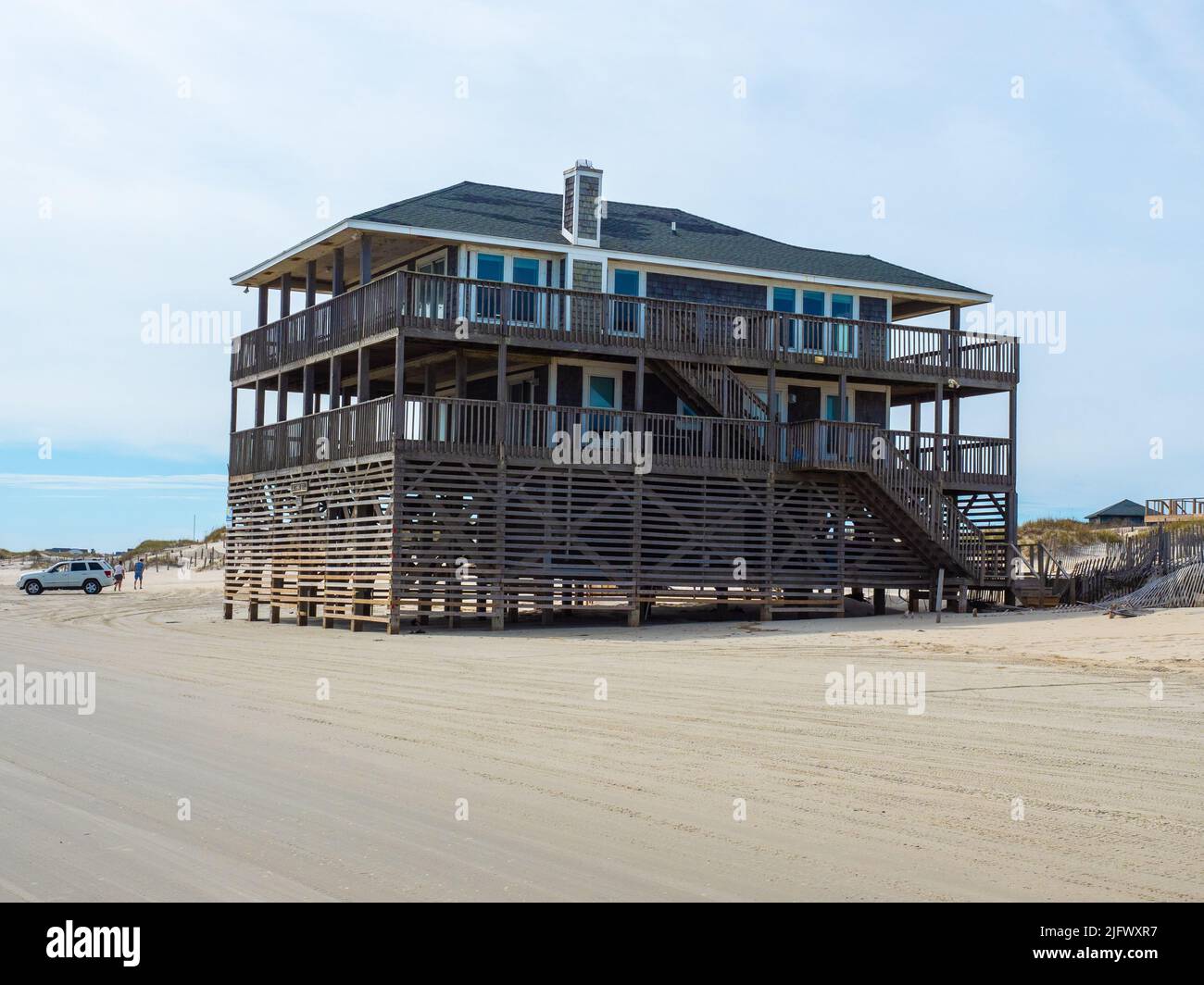 Beach home that is sitting directly on the beach near the ocean in ...