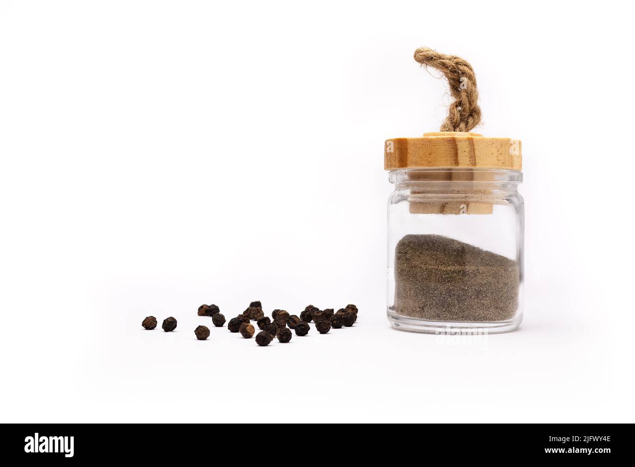 Organic black pepper seeds and powder on white background Stock Photo ...