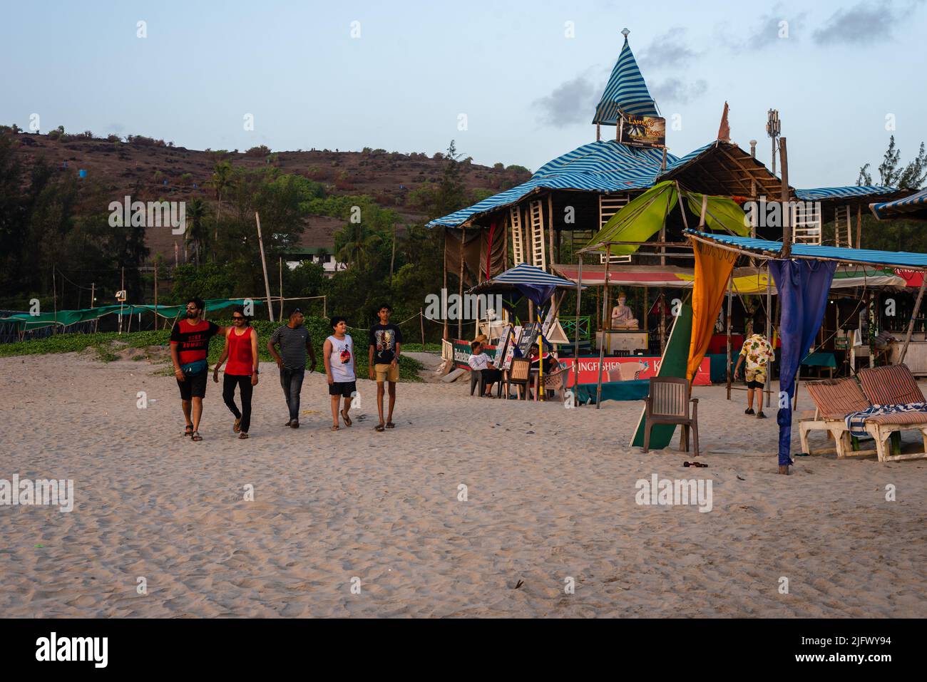 Mandrem Beach, Goa India May27 2022: Tourists and families relaxing and ...
