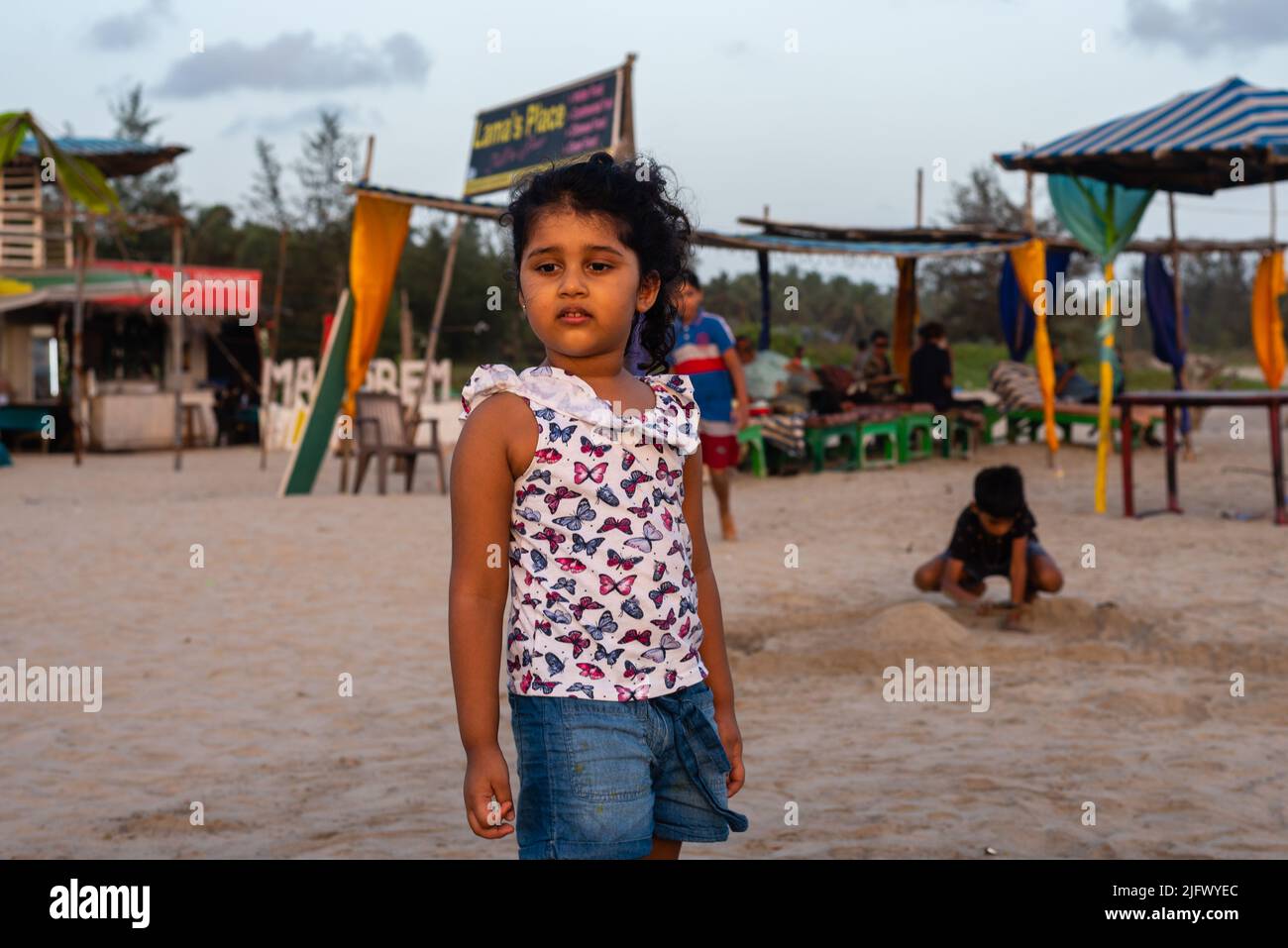 Mandrem Beach, Goa India May27 2022: Tourists and families relaxing and ...