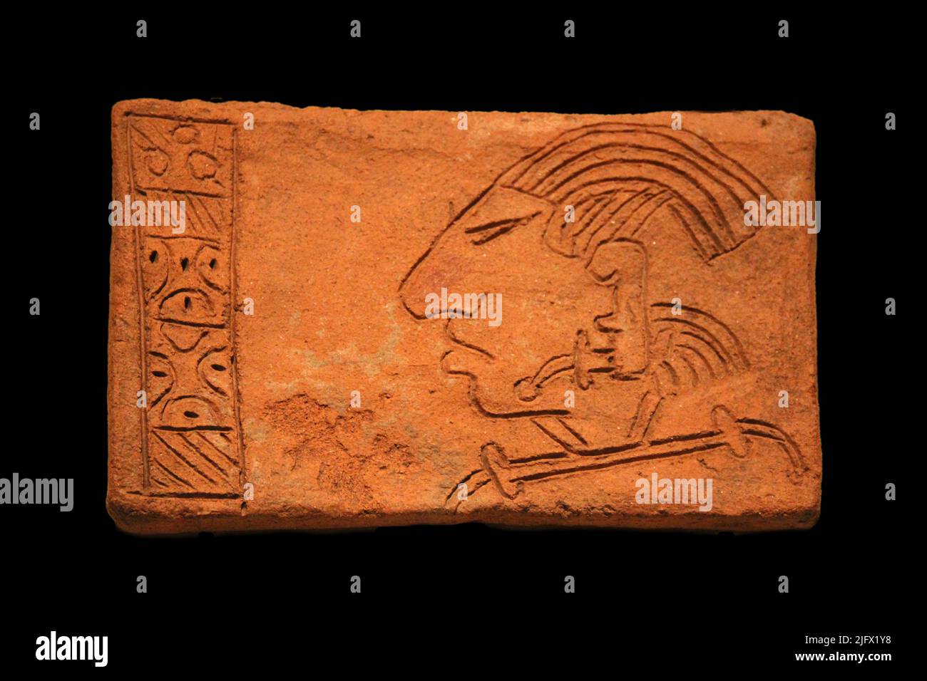 Classic Maya terracotta brick with engraved head and hieroglyphs. Late ...