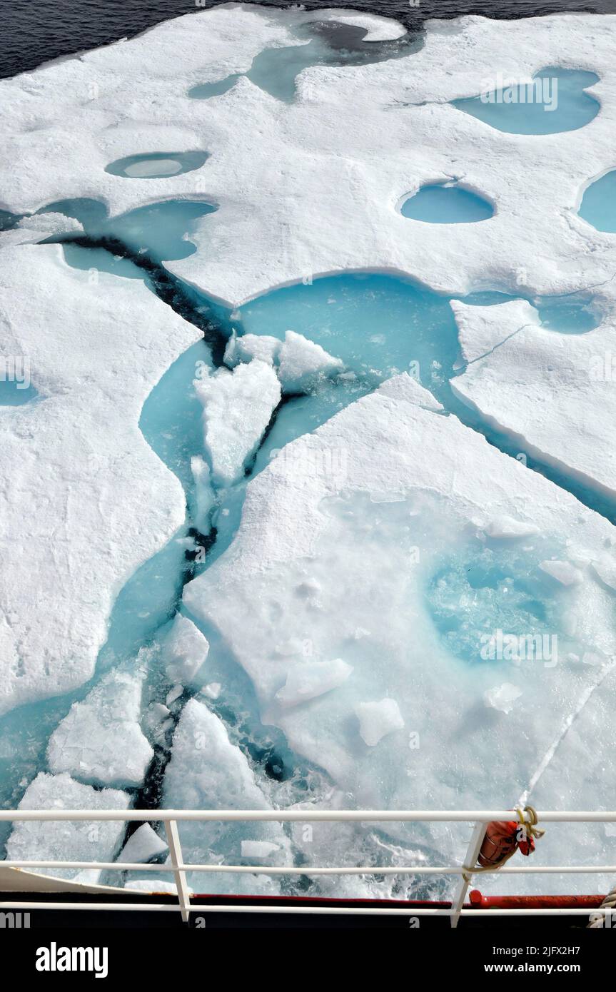 ARCTIC OCEAN - A multi-year ice floe slides down the starboard side of ...