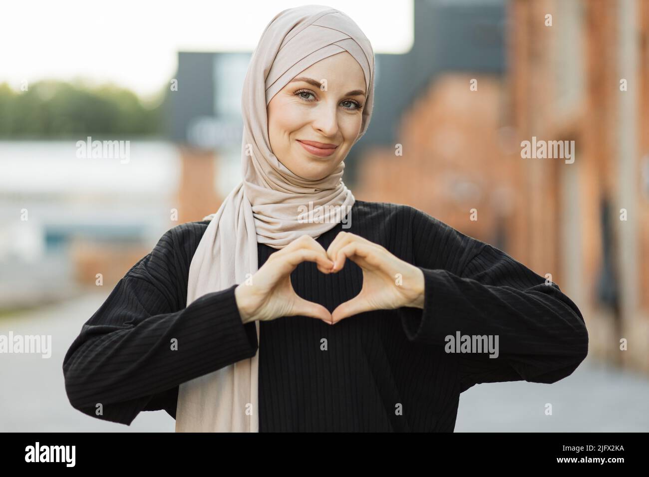 Beautiful young muslim woman smiling confident, enthusiastic and ...