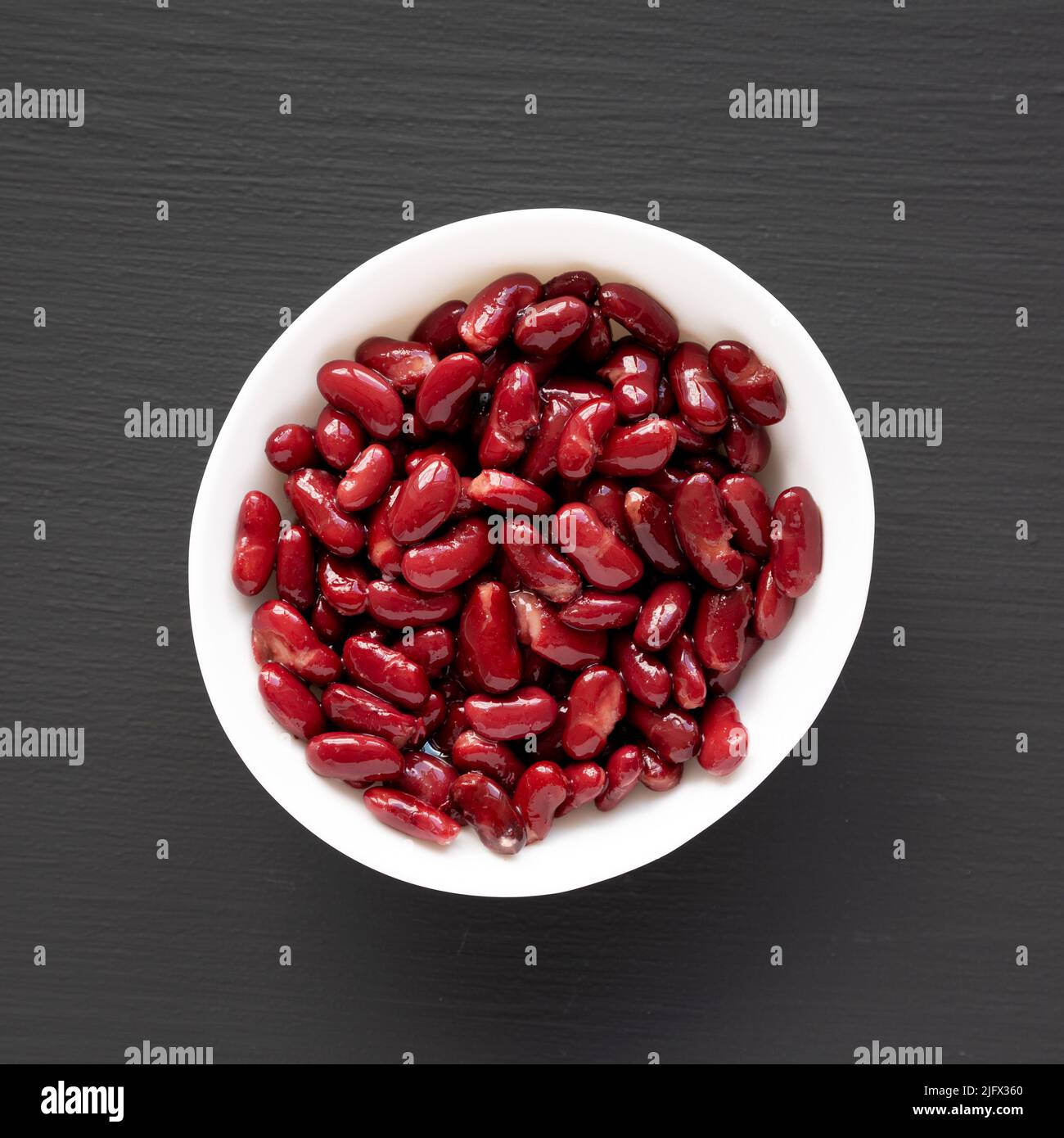 Red Organic Kidney Beans in a White Bowl on a black background, top ...
