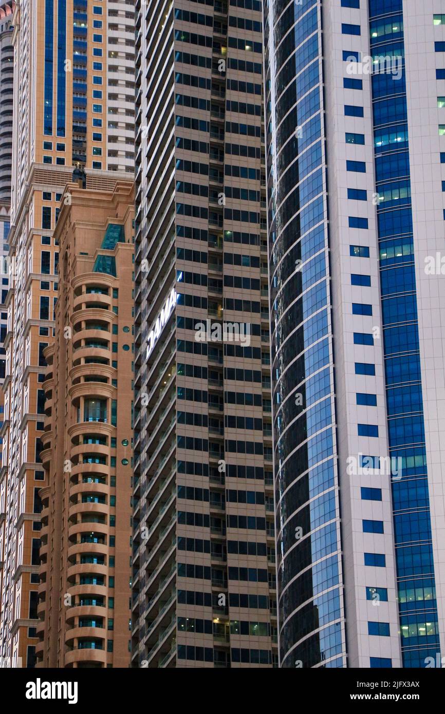 A vertical shot of newly built modern skyscrapers with windows of ...