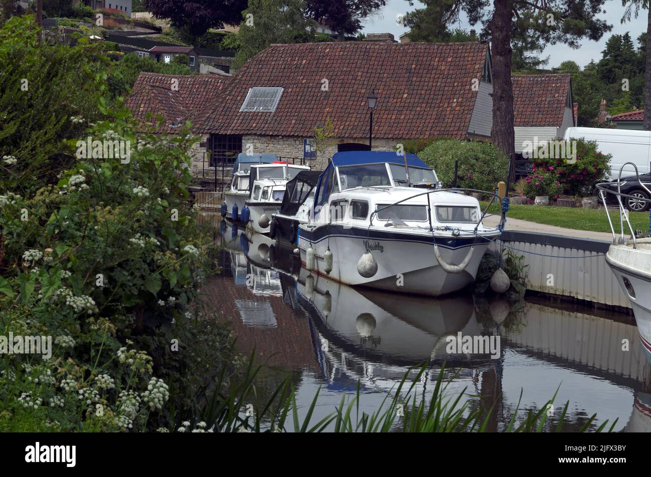 Boats at moorings, near Saltford Brass Mills, on the river Avon at ...