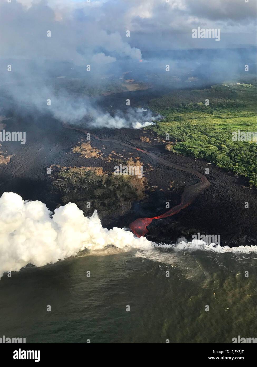 Kilauea Volcano - lva flow and active ocean entry. View from a ...