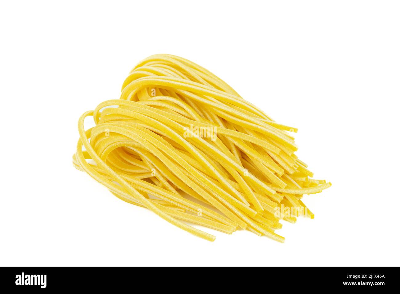 Bunch of spaghetti pasta for cooking on white background Stock Photo ...