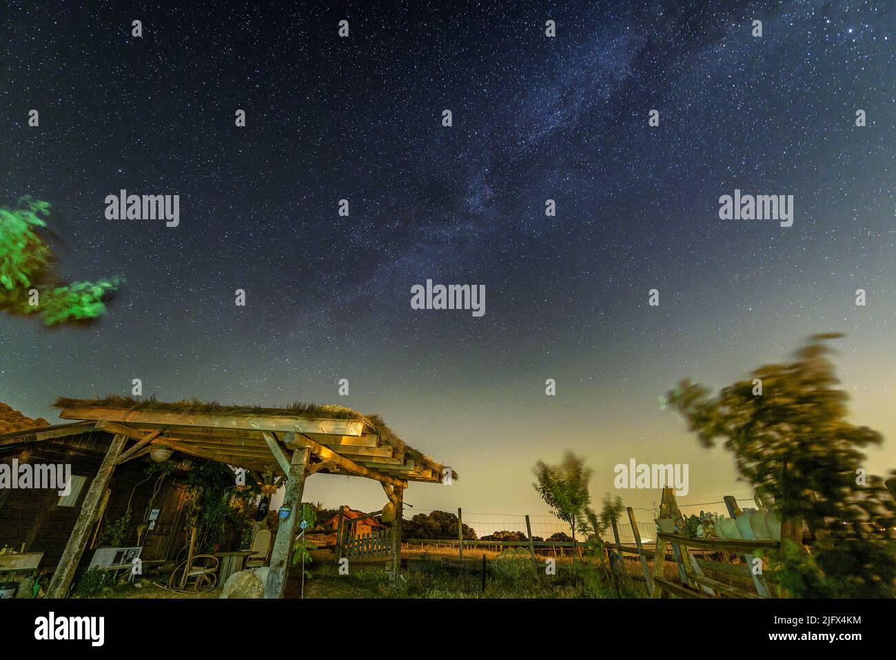 Rural environment landscape. Starry sky with milky way over farm. Light ...
